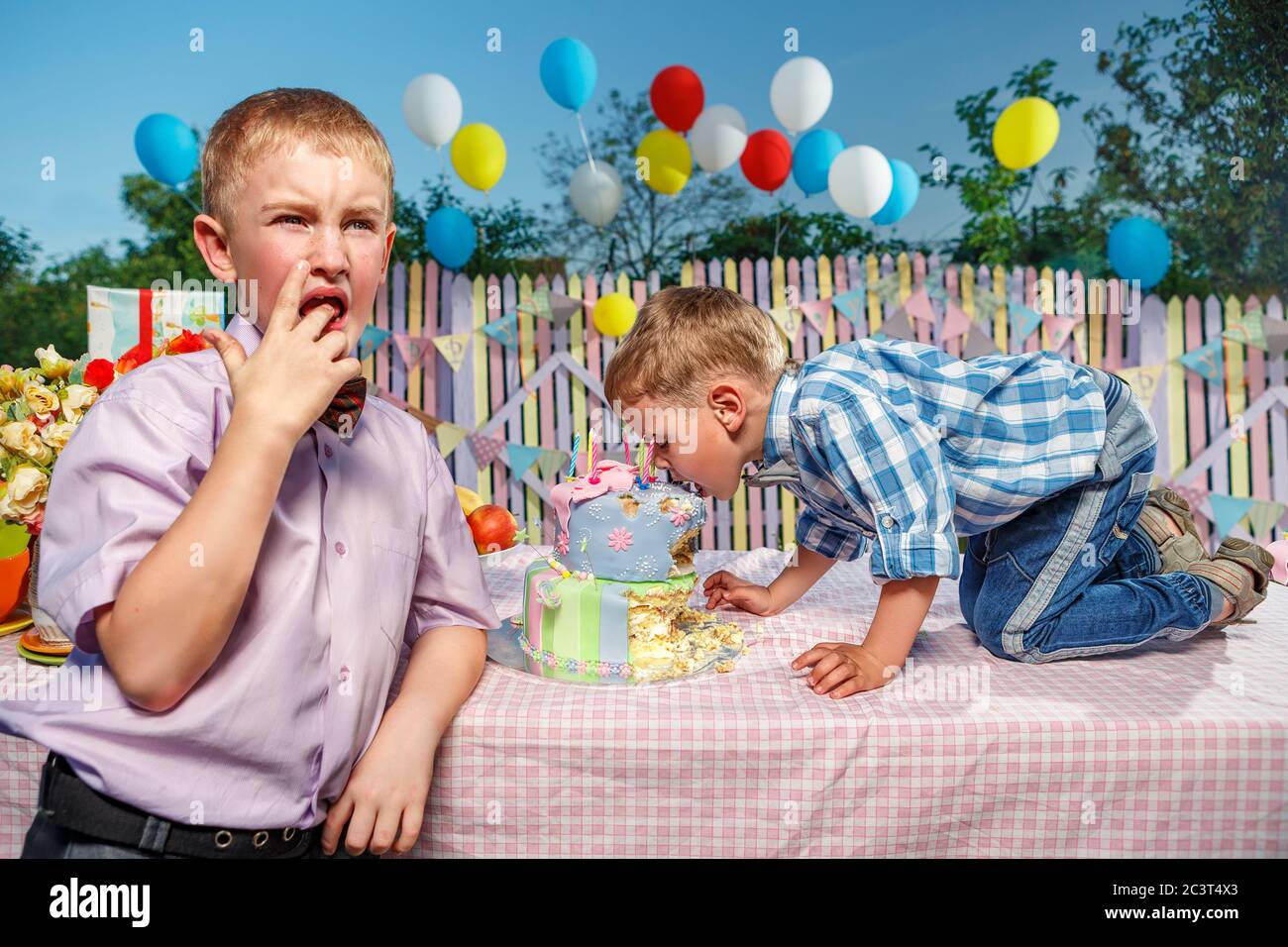 Young people eating at birthday party hi-res stock photography and ...