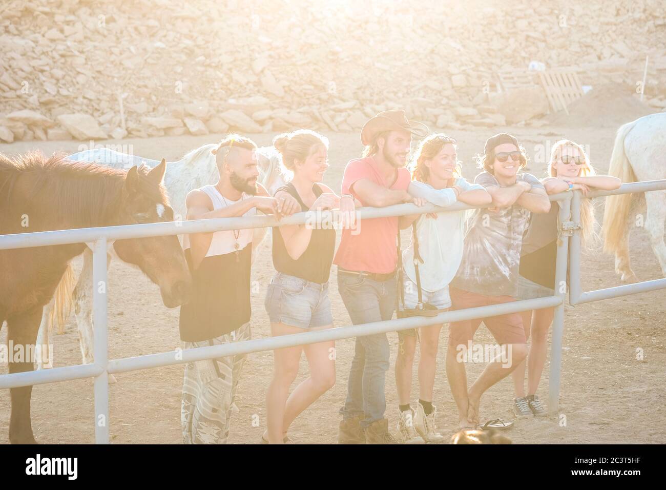 Group of friends enjoying friendship together during the suny sunset in ...
