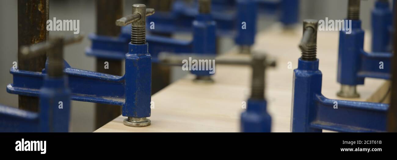 New blue metal clamp Stock Photo - Alamy