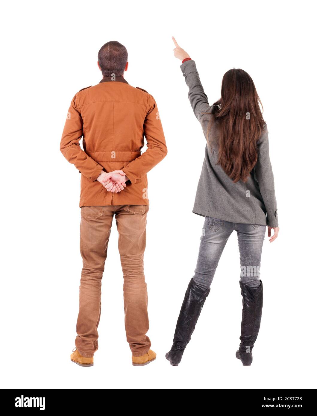 Back view of two pointing girl in winter jacket. Rear view people ...