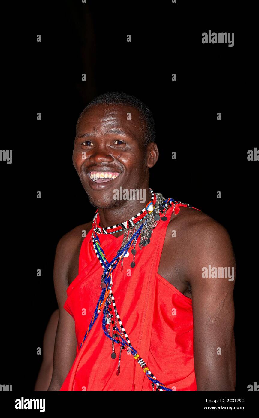 Maasai man smiling wearing traditional attire, in Maasai Mara National ...