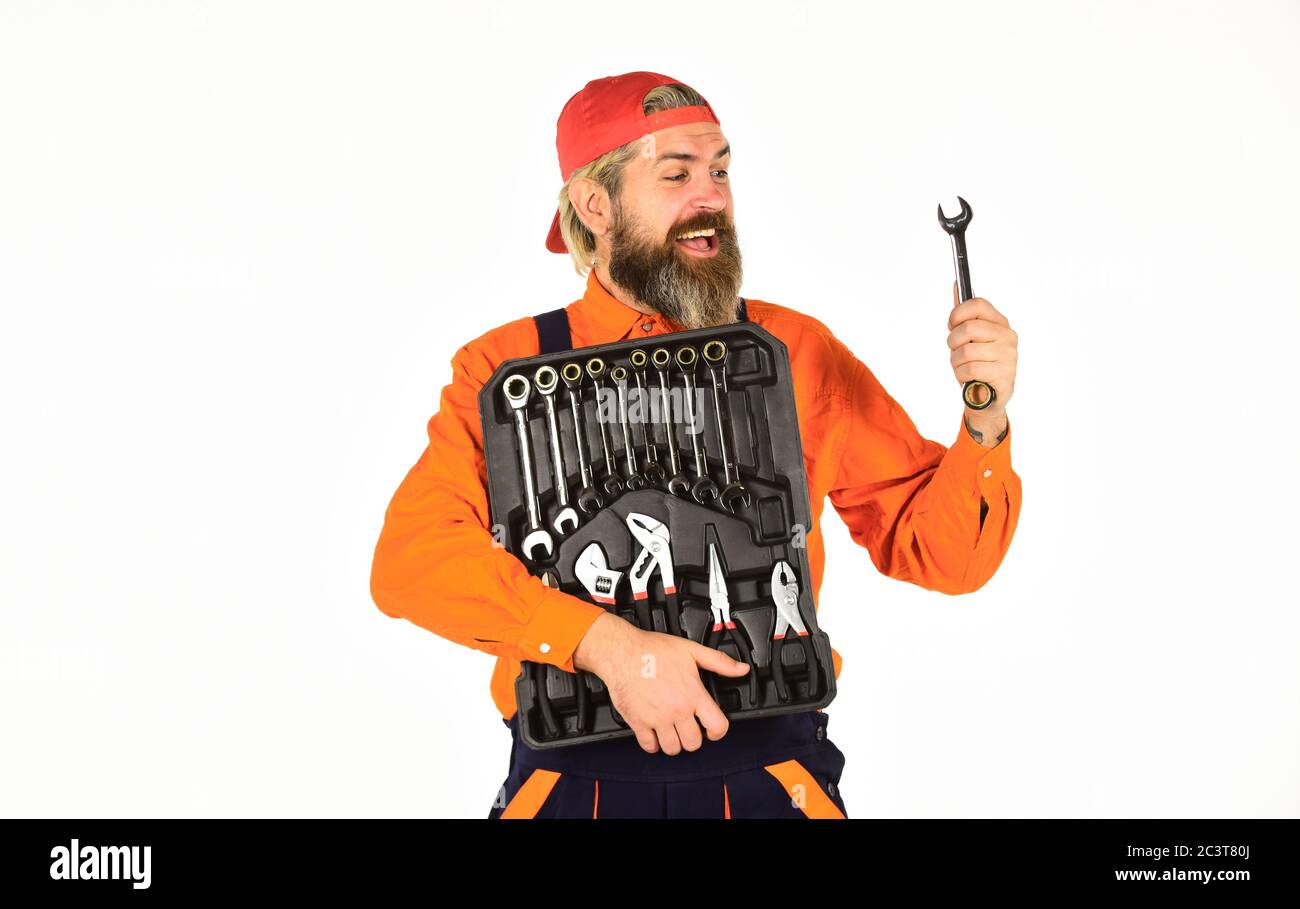 What to Carry in Your Car Toolbox. Man in uniform carries toolbox white ...