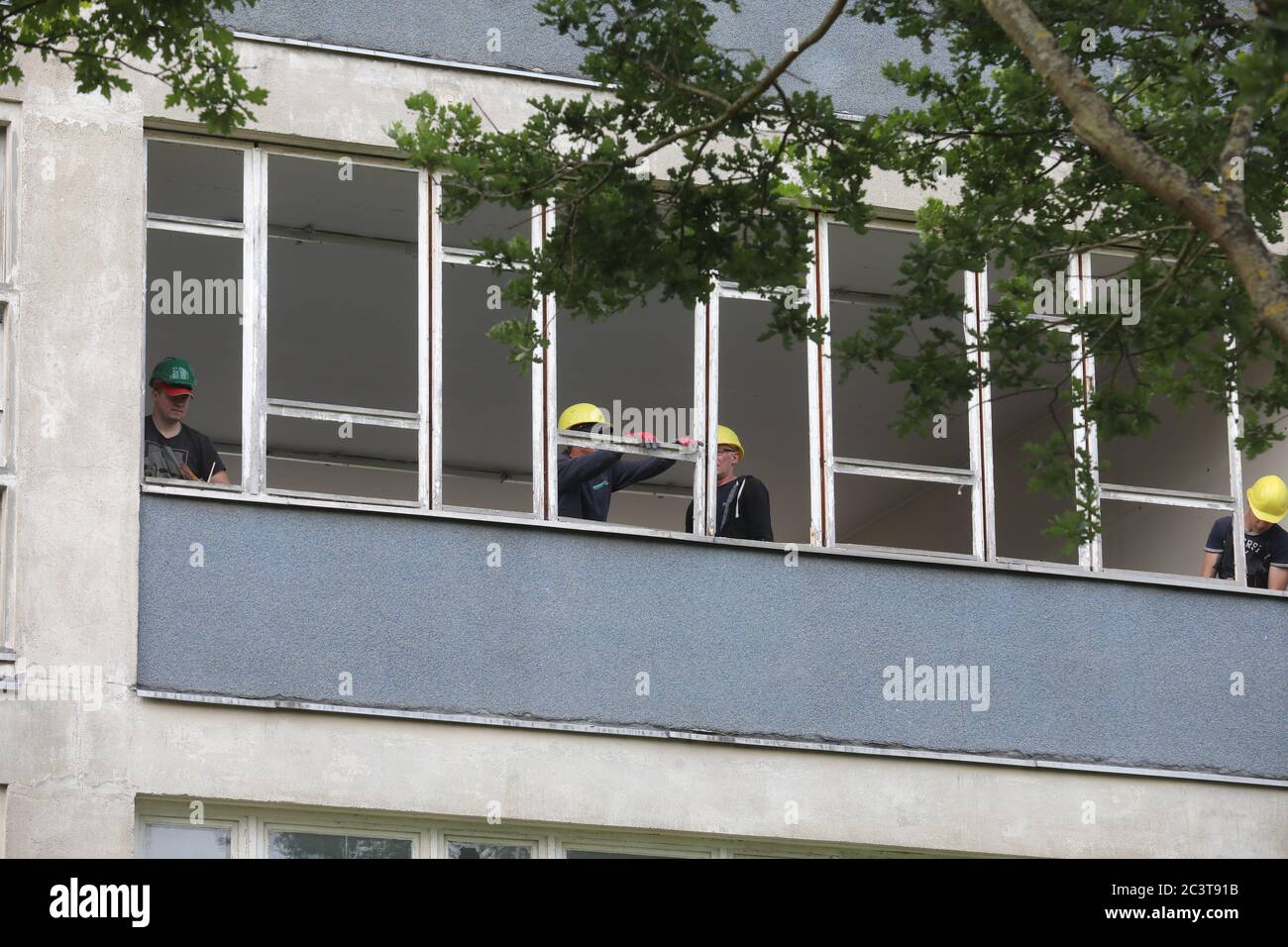 Gera, Germany. 22nd June, 2020. Construction workers remove window ...