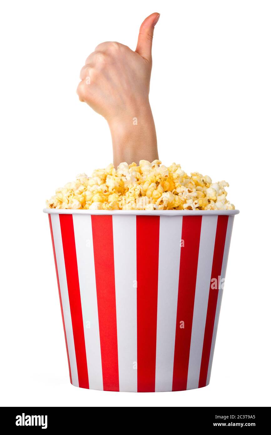 Female hand sticks out of a bucket with popcorn isolated on white ...
