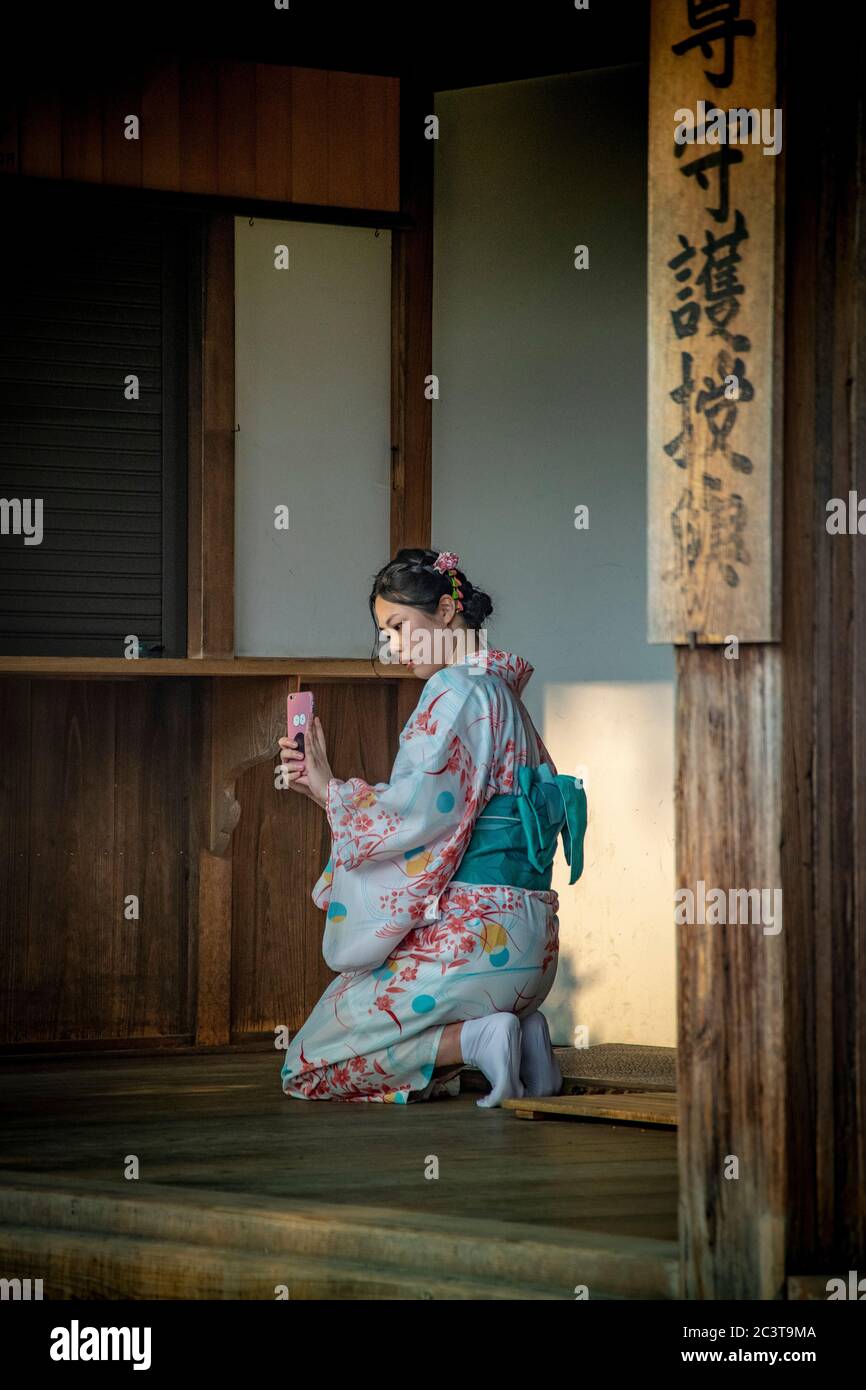Geisha on her knees in a wooden temple in Kyoto Stock Photo - Alamy
