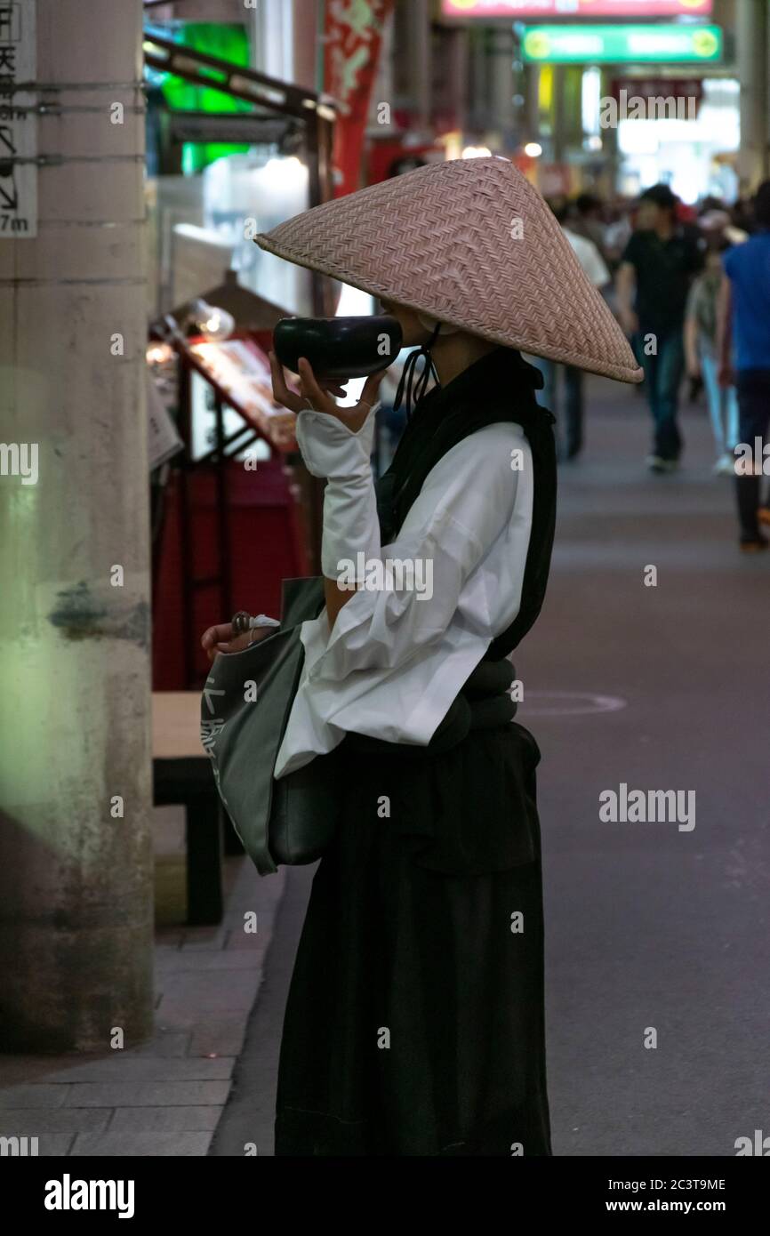 Typical Shinto monk at a street market in Japan Stock Photo - Alamy