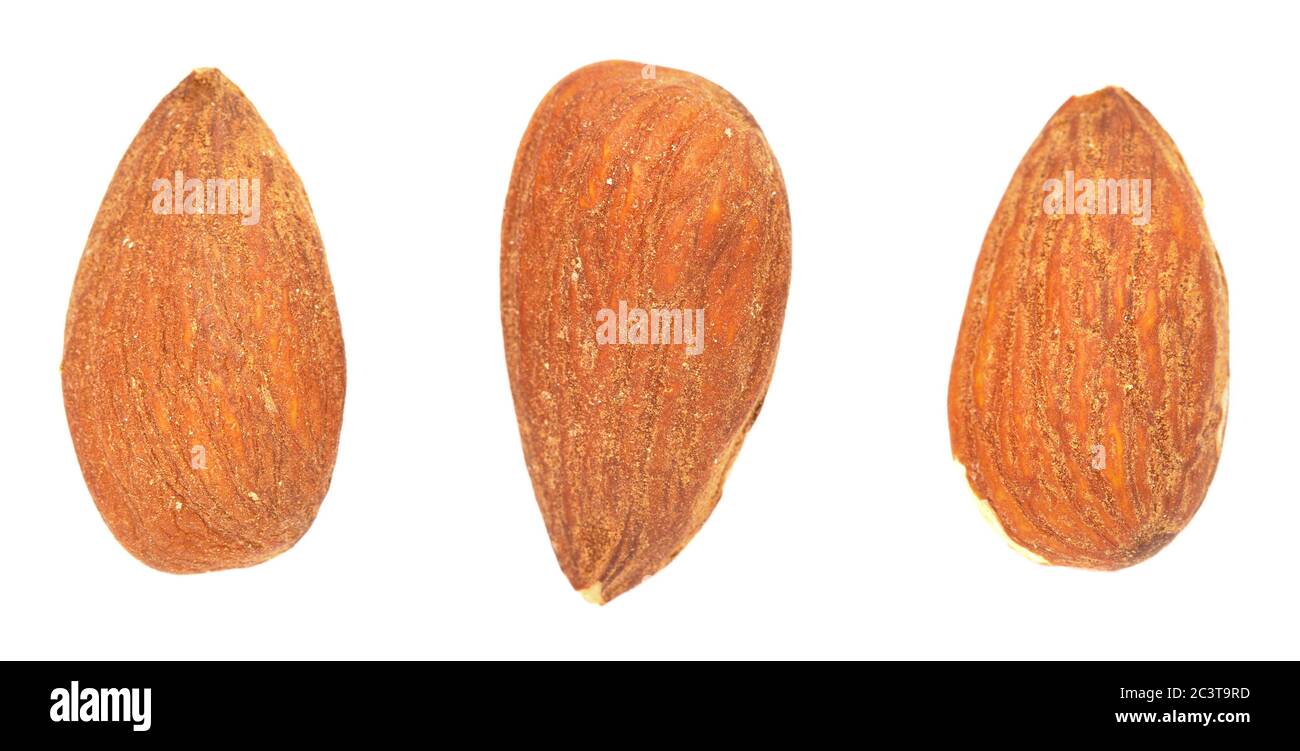 Three Almond kernels on a white background Stock Photo - Alamy