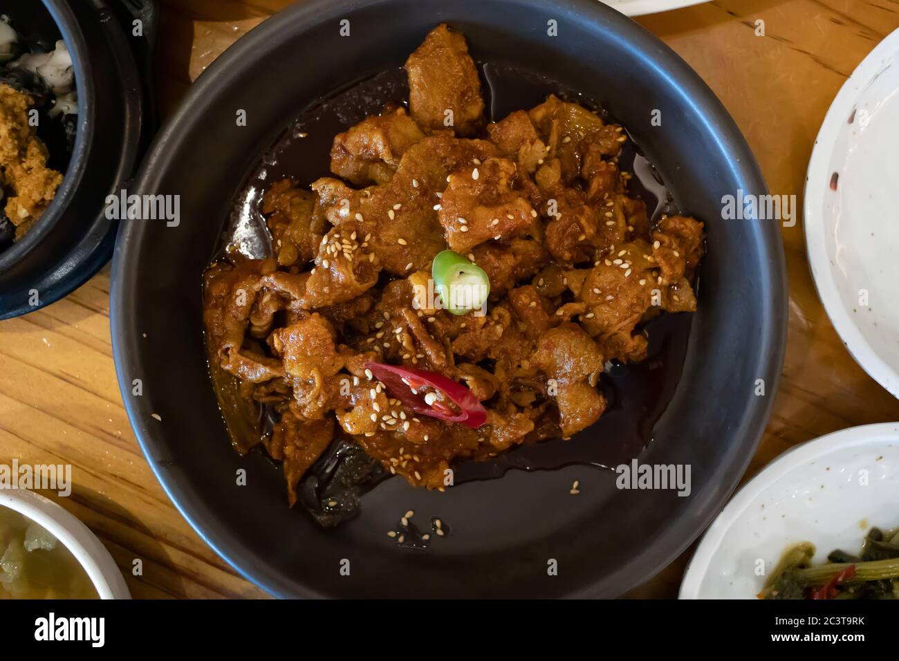 Korean name Dwaeji-bulgogi. stir-fried spicy pork Stock Photo - Alamy