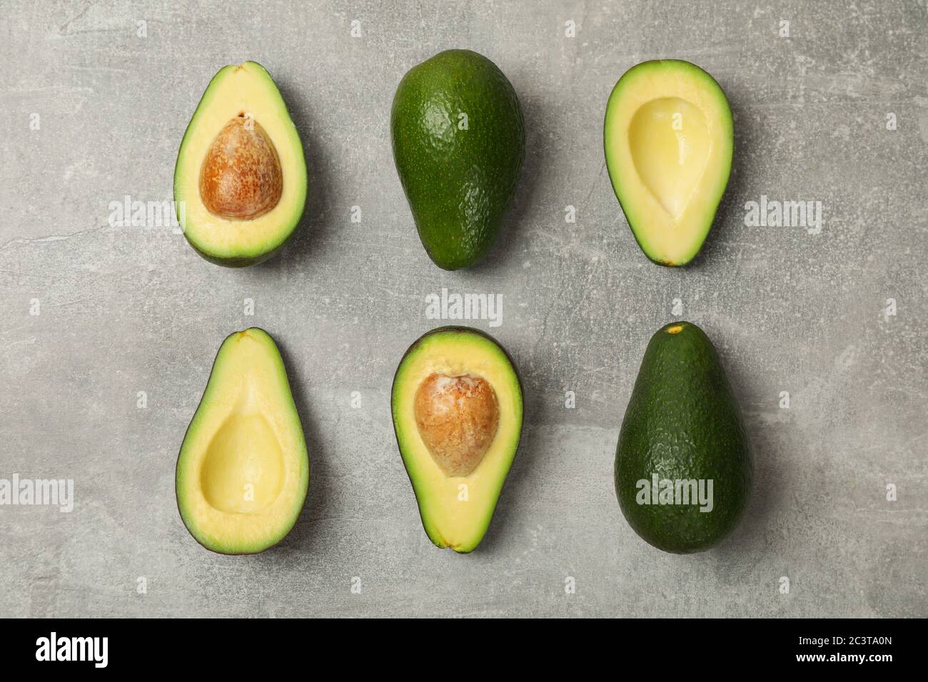 Flat lay with avocado on gray background, top view Stock Photo - Alamy