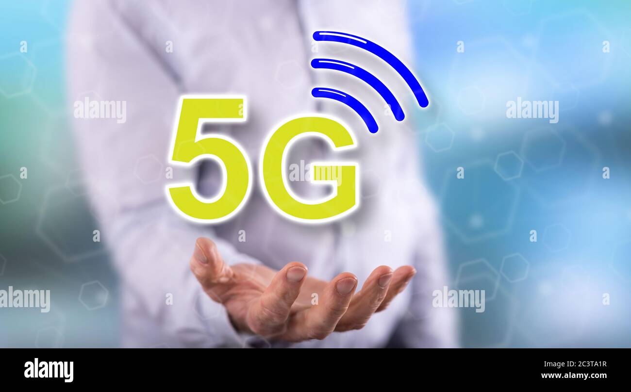 5g concept above the hand of a man in background Stock Photo - Alamy