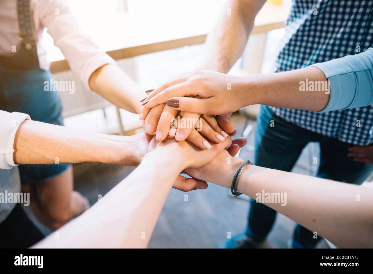 Business people join hand together during their meeting Stock Photo - Alamy