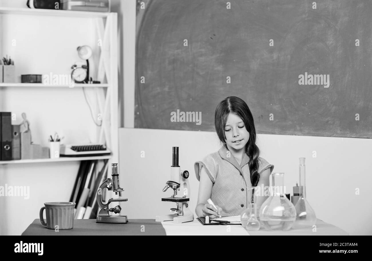 Biology education. Science lesson. School laboratory. Small girl with ...