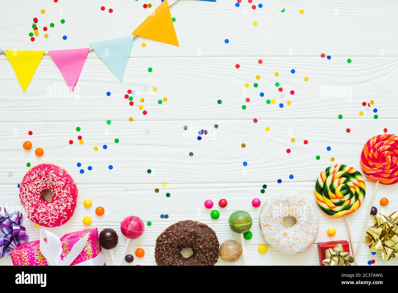 Bright birthday background with sweets and decorations Stock Photo - Alamy