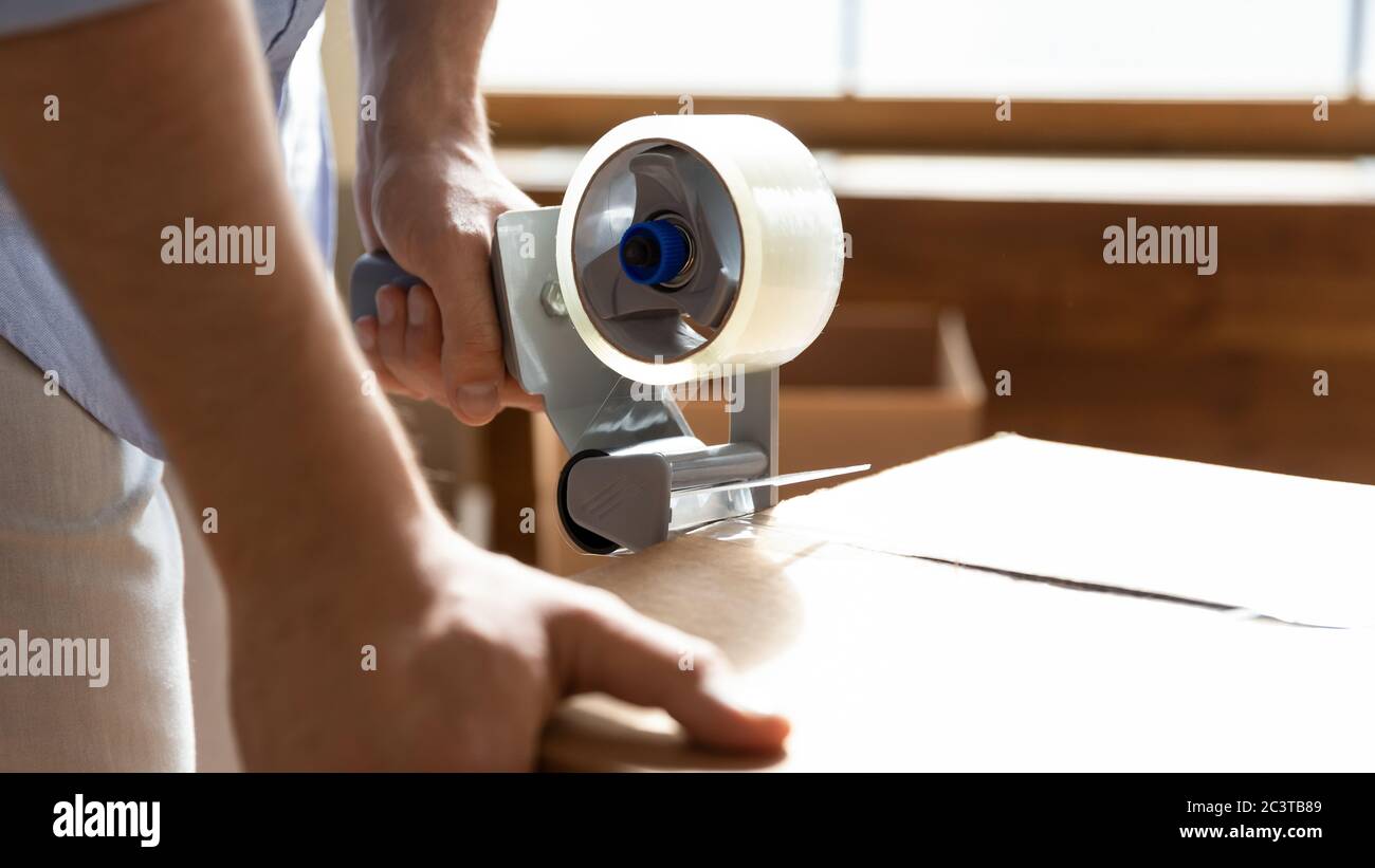 Using sticky tape hi-res stock photography and images - Alamy