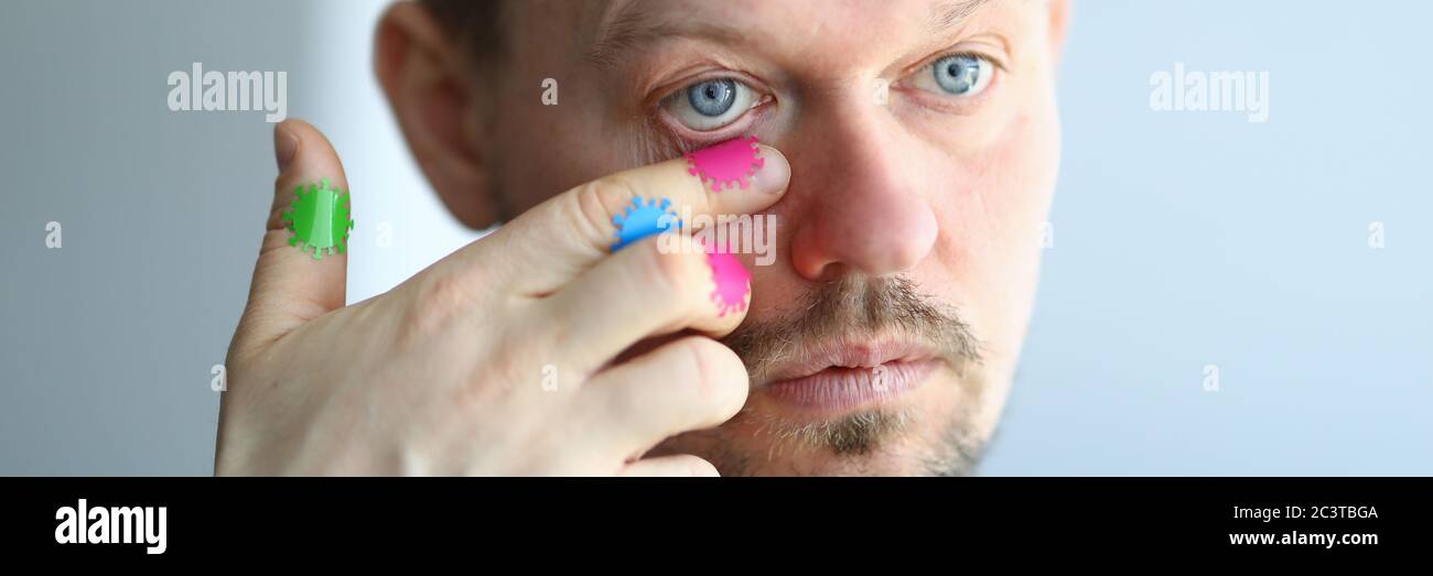 Man scratches his face with a dirty hand near his eye Stock Photo - Alamy