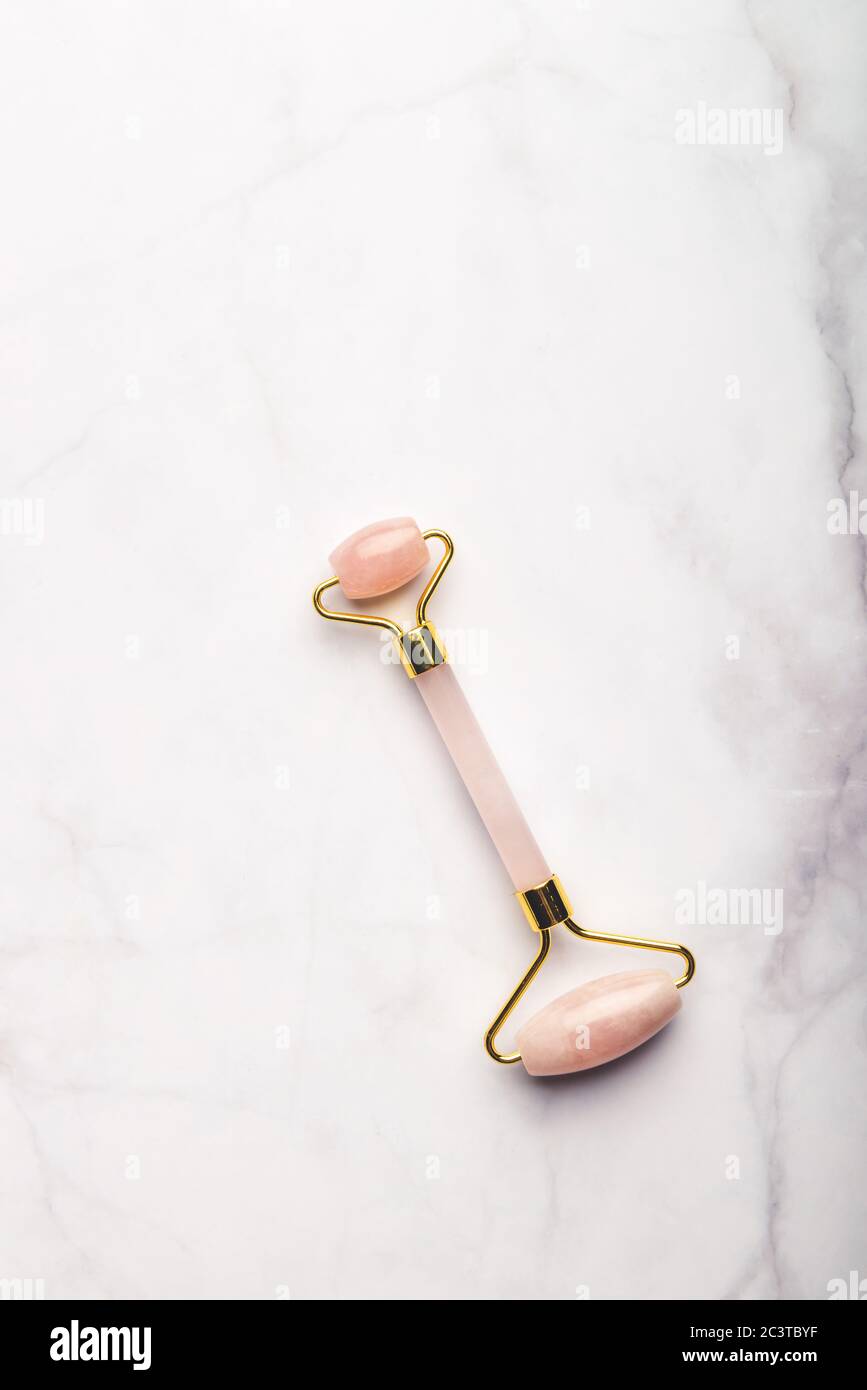 Rose Quartz Jade face roller Stock Photo - Alamy