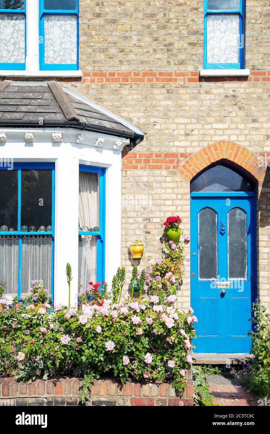 Blue Door Cottage Facade Stock Photo - Alamy