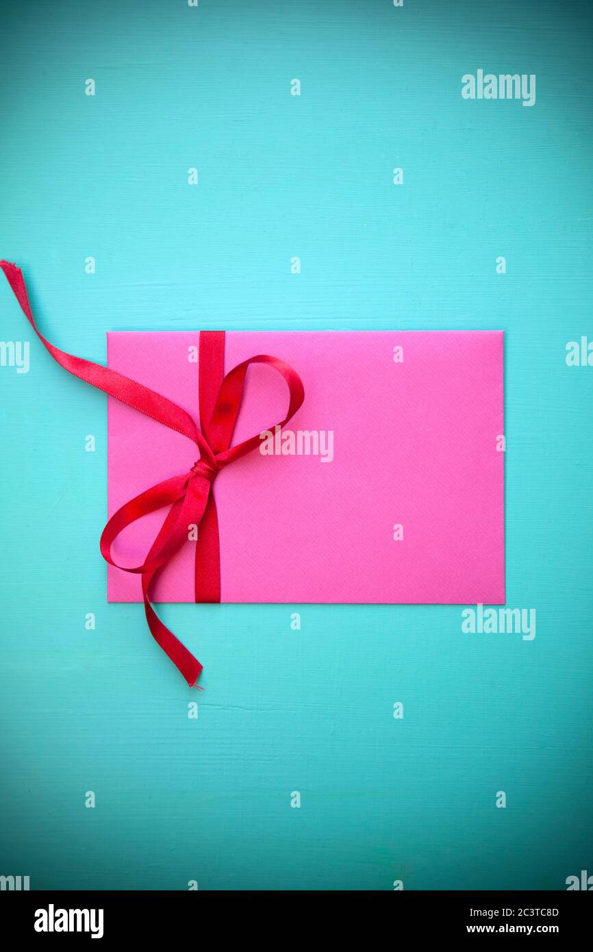 Pink Envelope and Red Ribbon Stock Photo - Alamy