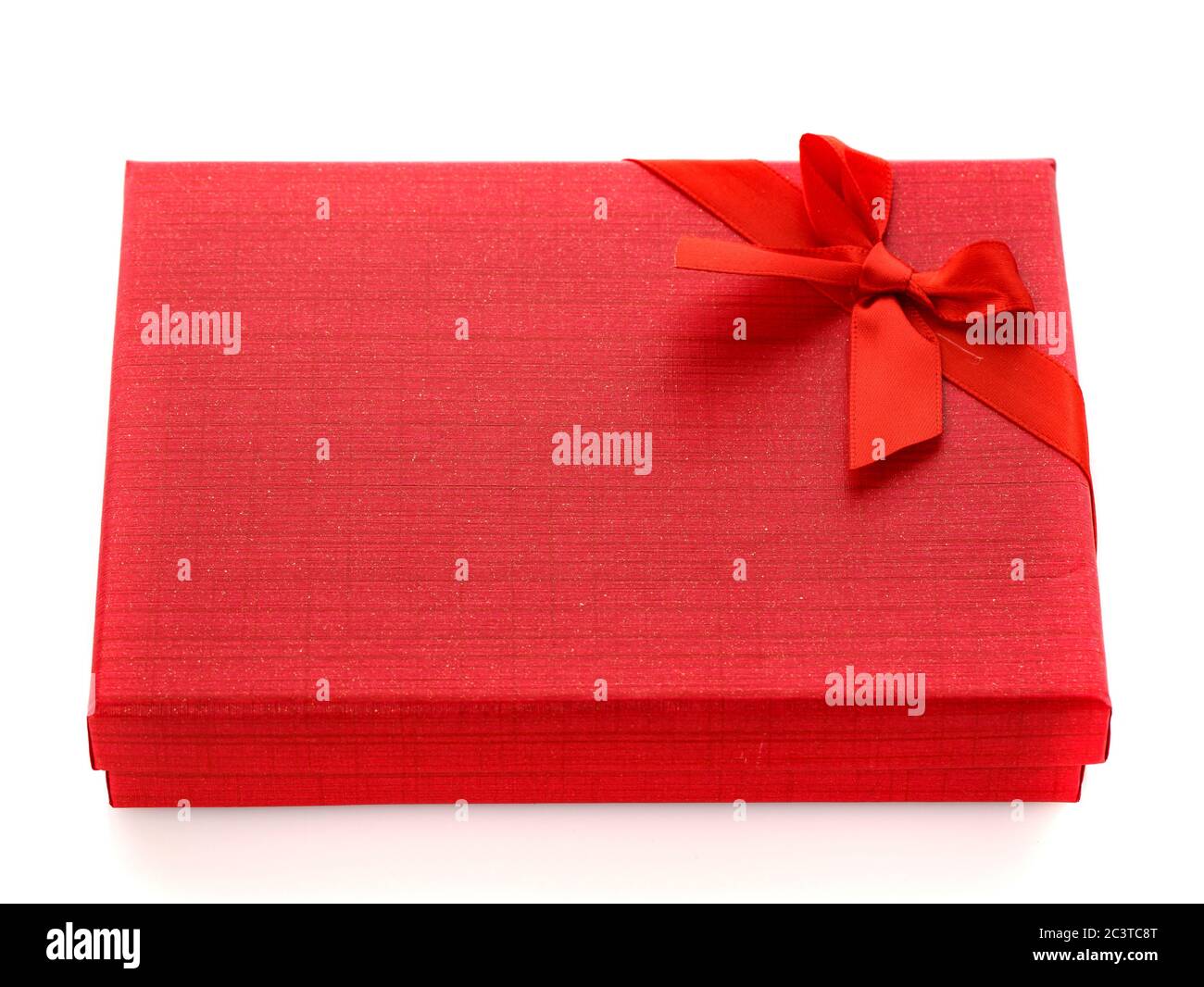 Red gift box with red ribbon bow isolated on white background. Side ...