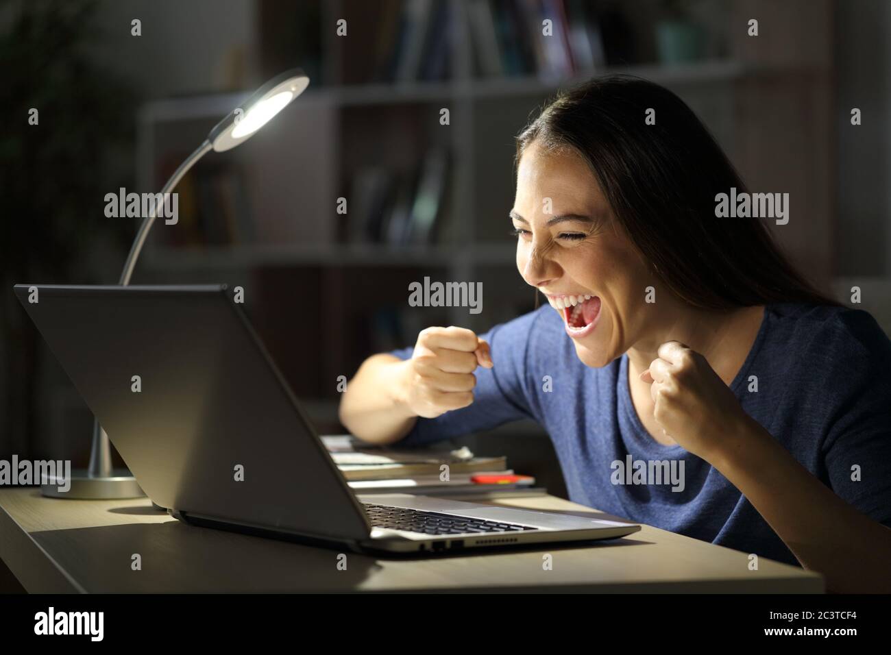 Excited woman computer home hi-res stock photography and images - Alamy