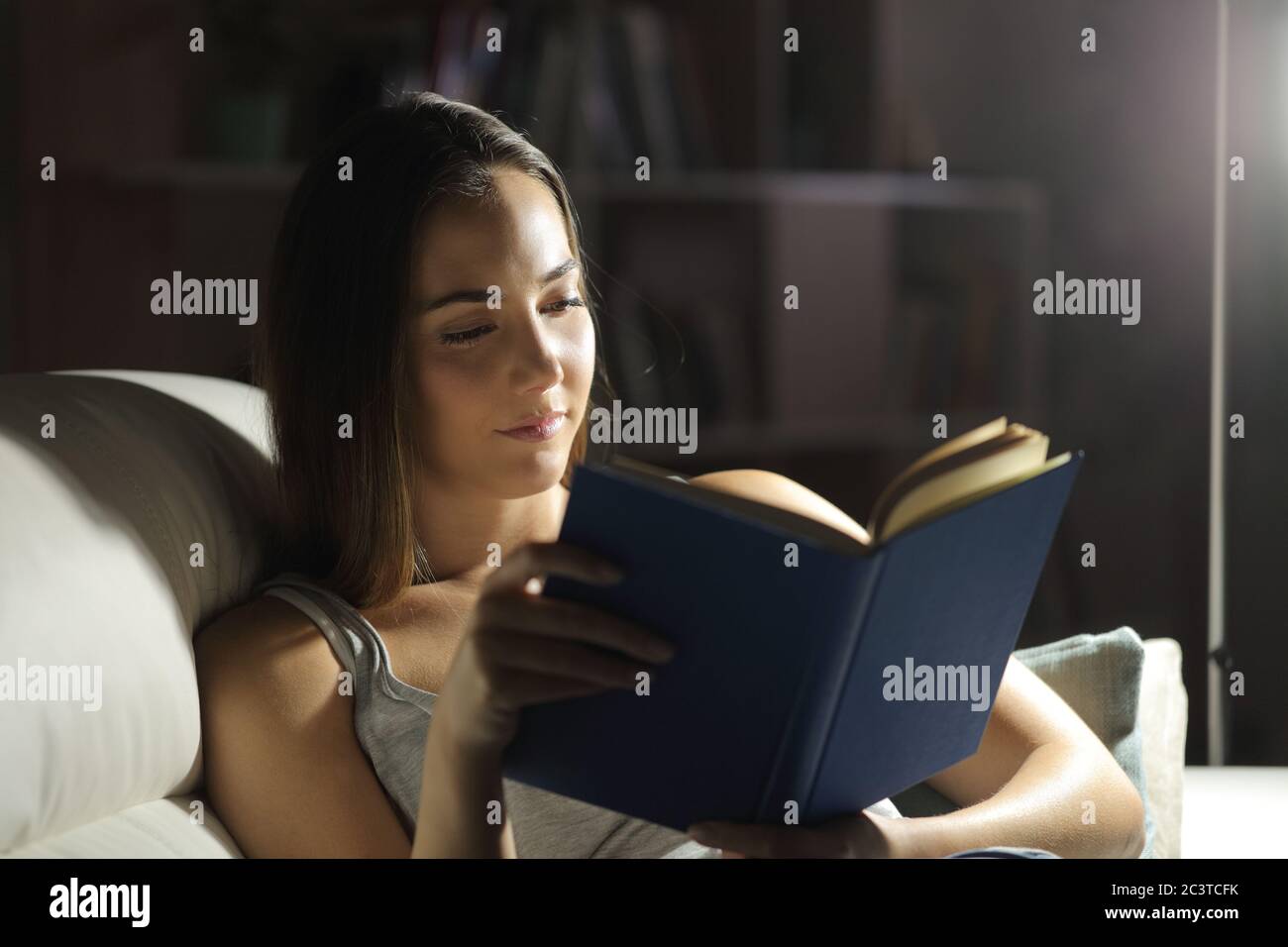 Adult reading relaxed book hi-res stock photography and images - Alamy