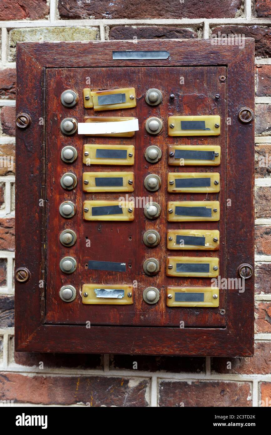 Bell board with many bells and name tags Stock Photo - Alamy