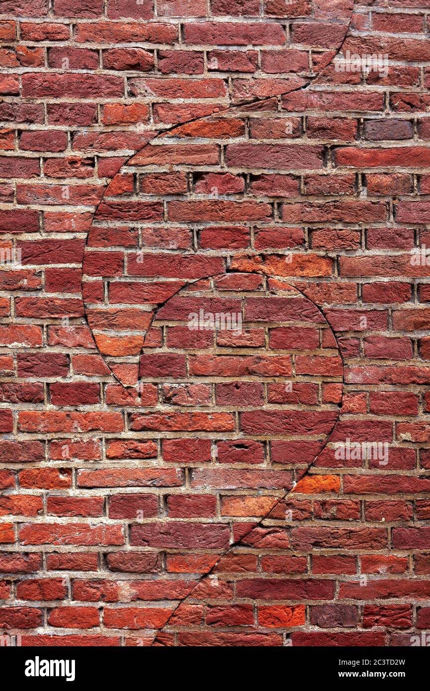 Brick wall with cut wave pattern Stock Photo - Alamy