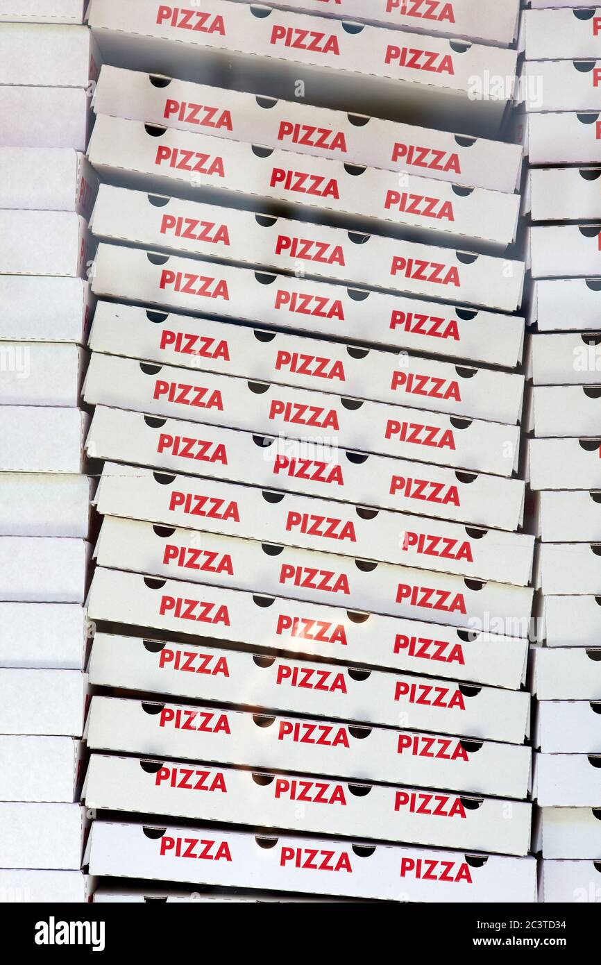 Many empty pizza boxes in the window of a pizza delivery service Stock ...