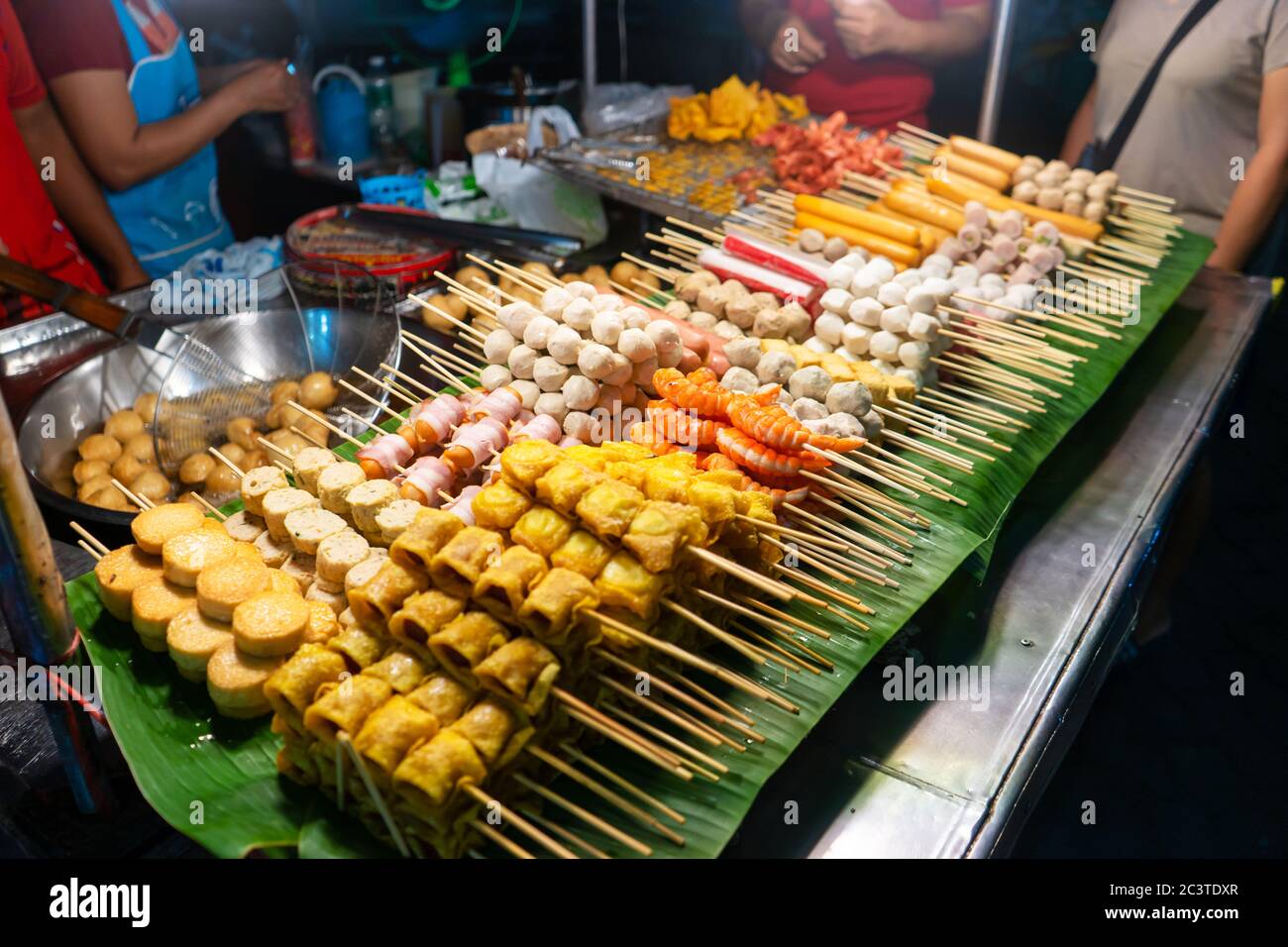 Asian food. Different mini barbecue counter at night street food market ...