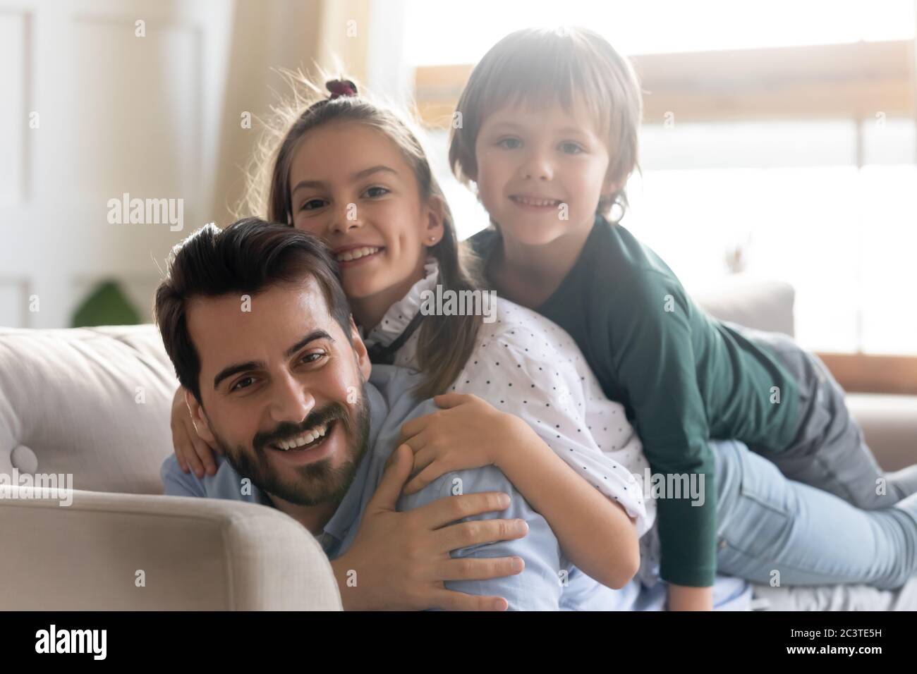 Head shot portrait happy father relaxing with adorable children Stock ...