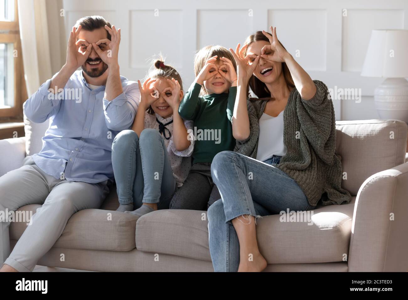 Family portrait happy parents with children making funny faces Stock ...