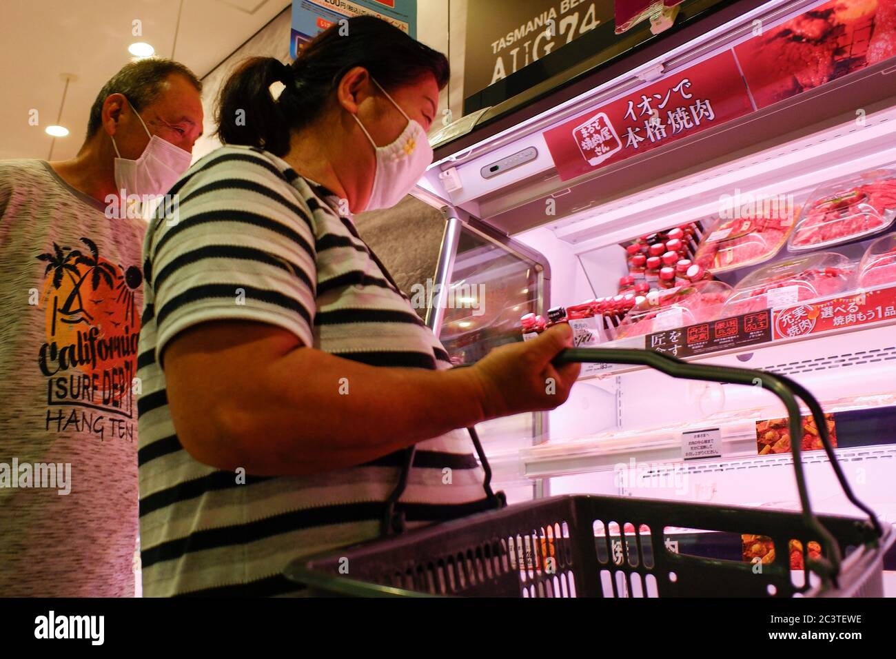 People shopping at AEON Shopping Mall while wearing face masks as a ...
