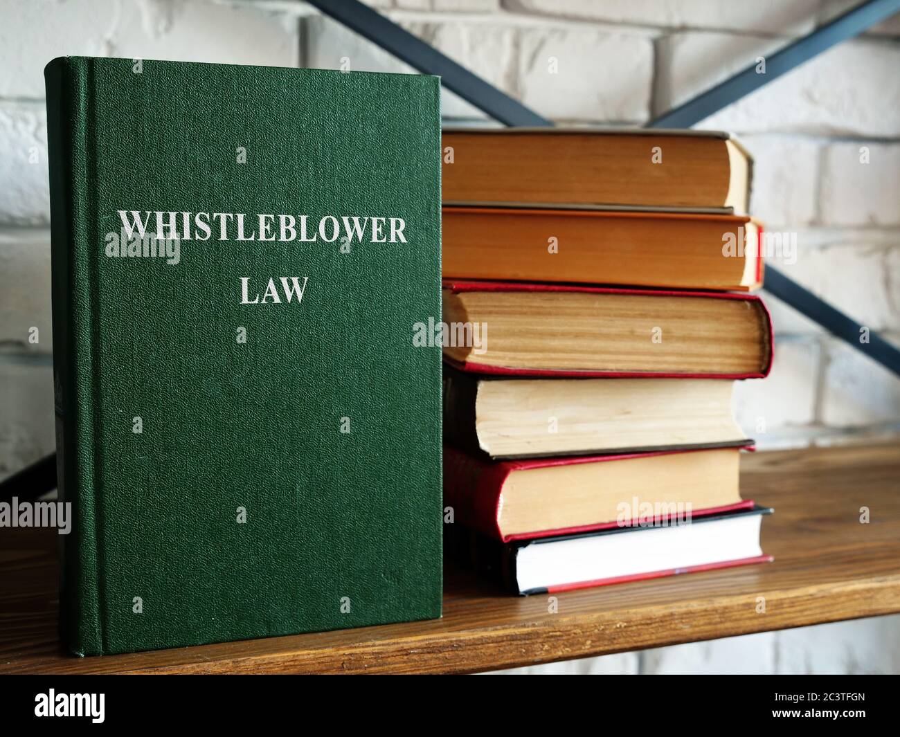 Whistleblower law and a stack of book on a shelf Stock Photo - Alamy
