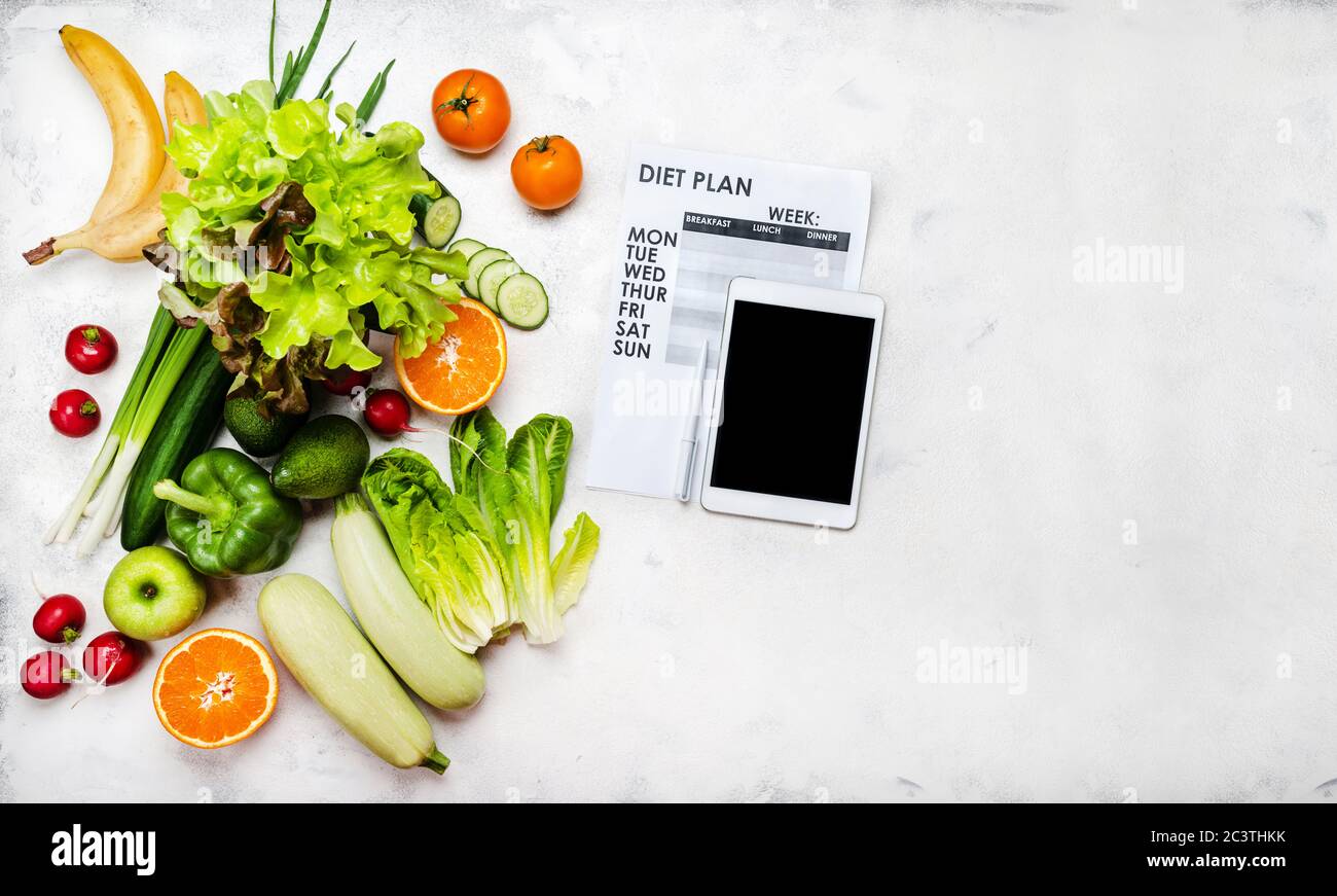 Healthy diet set. Plan of Weight loss program on the sheet and tablet ...