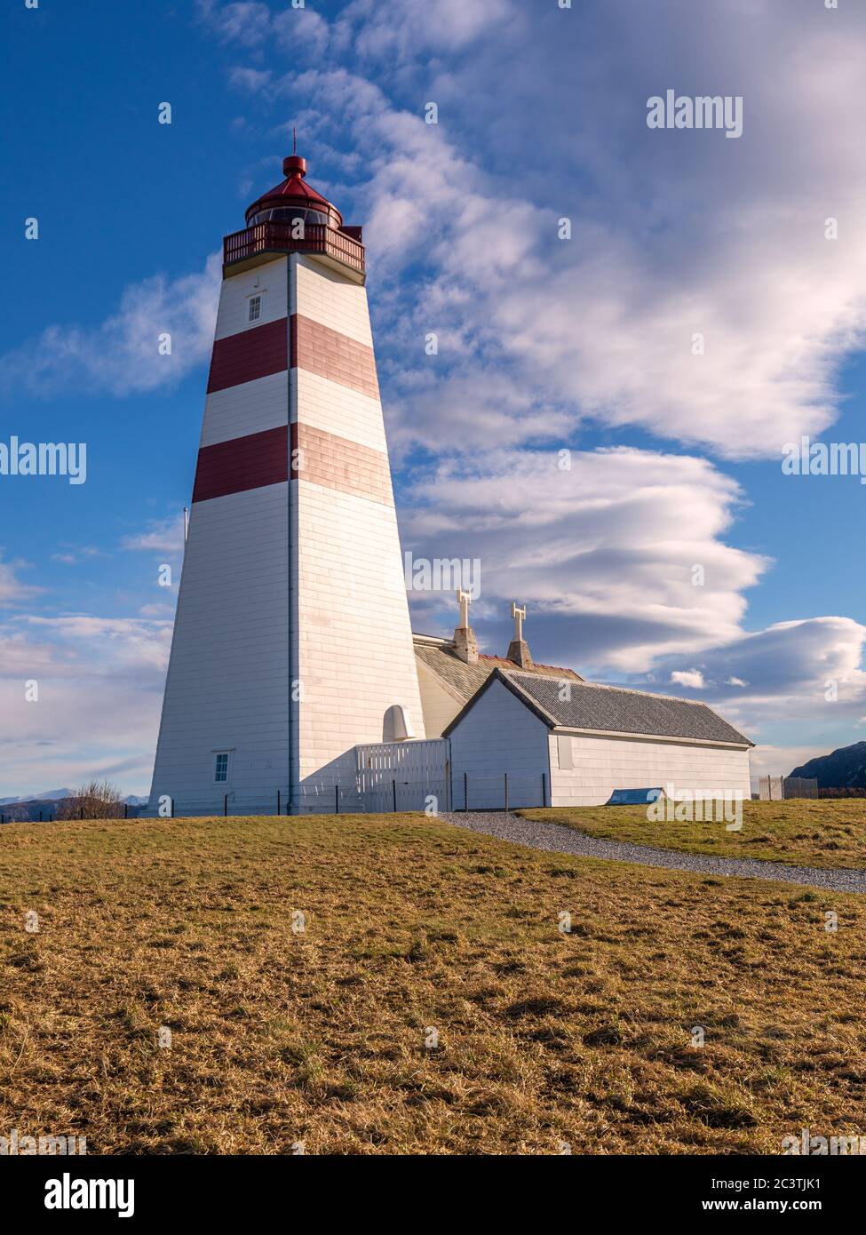 Famous Alnes lighthouse in tranquil spring day. High wooden tower of ...