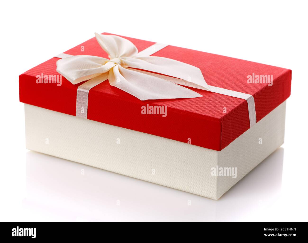 Red gift box with white ribbon bow isolated on white background. Side ...