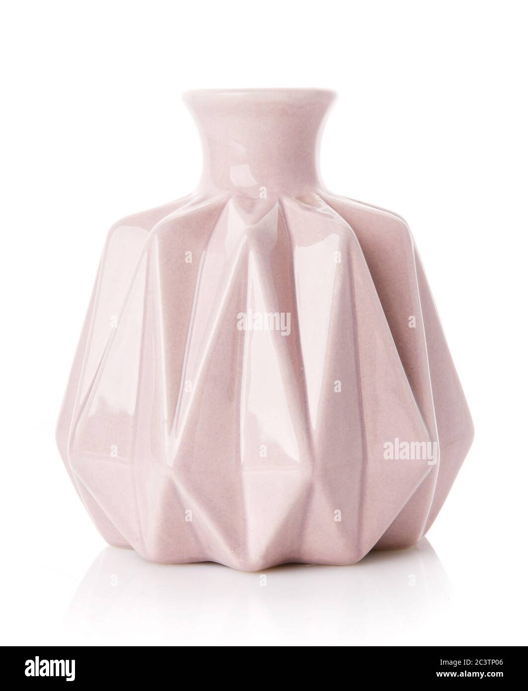 Decorative ribbed vase of pink color on a white background Stock Photo ...