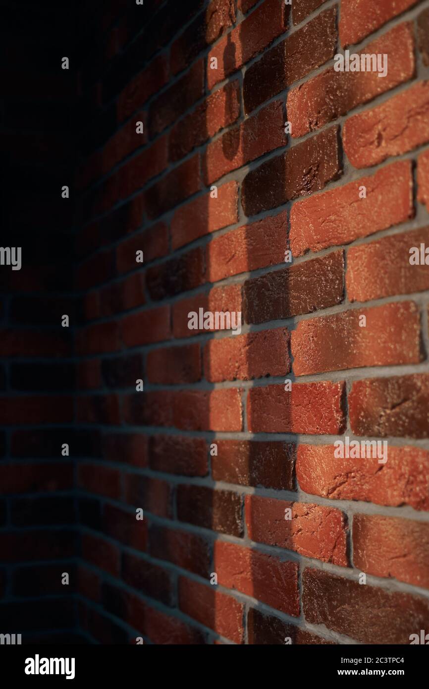 Red brick wall in a designer minimalist room interior of an architect ...