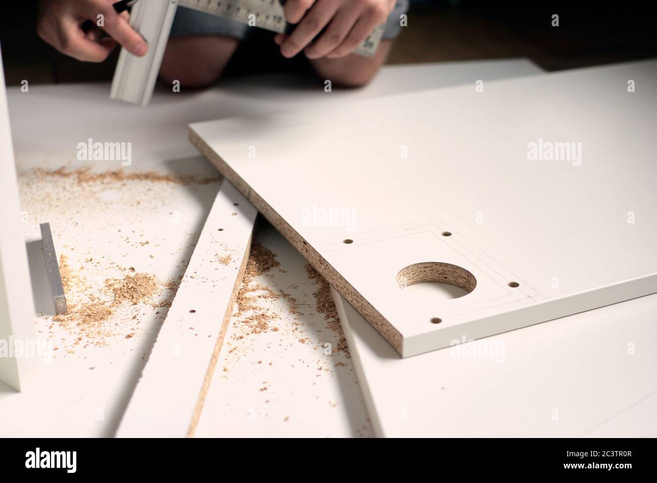 Man doing renovation work at home, drilling with a screwdriver. Group ...