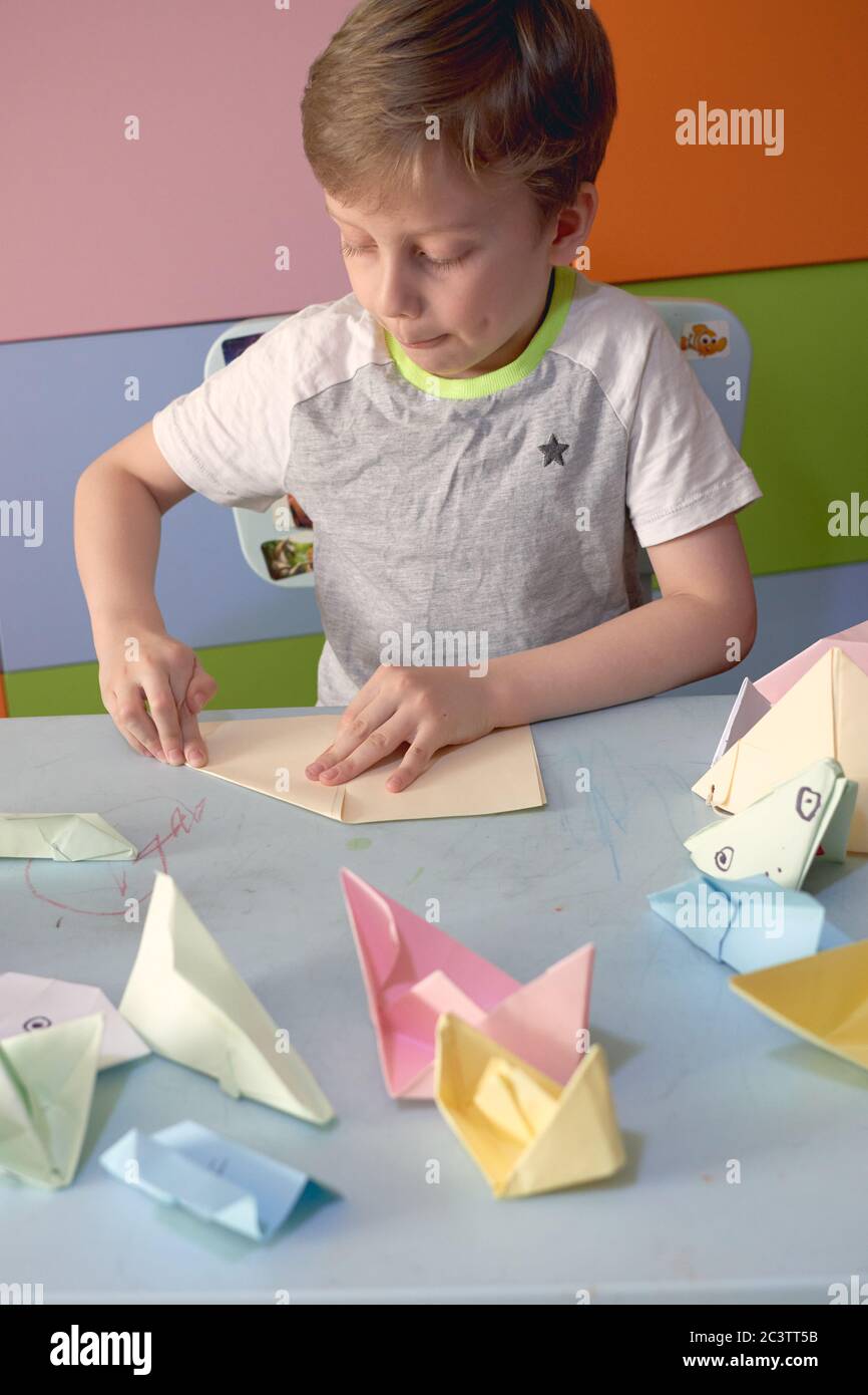 6 years boy makes an origami planes and frogs during quarantine Covid ...