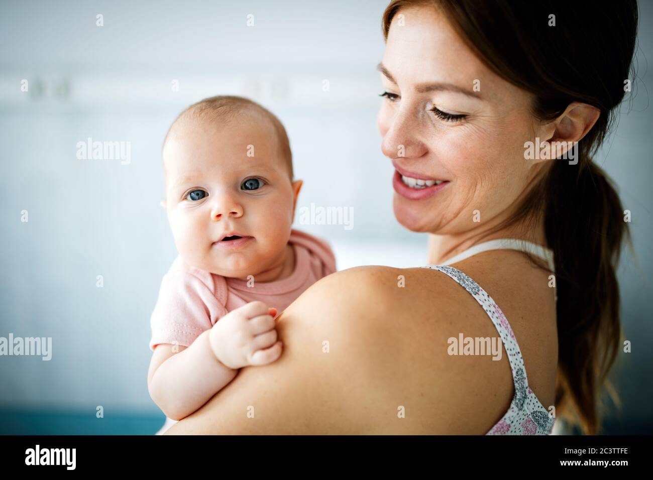 Beautiful mother and her newborn baby together. Love, happiness, family ...