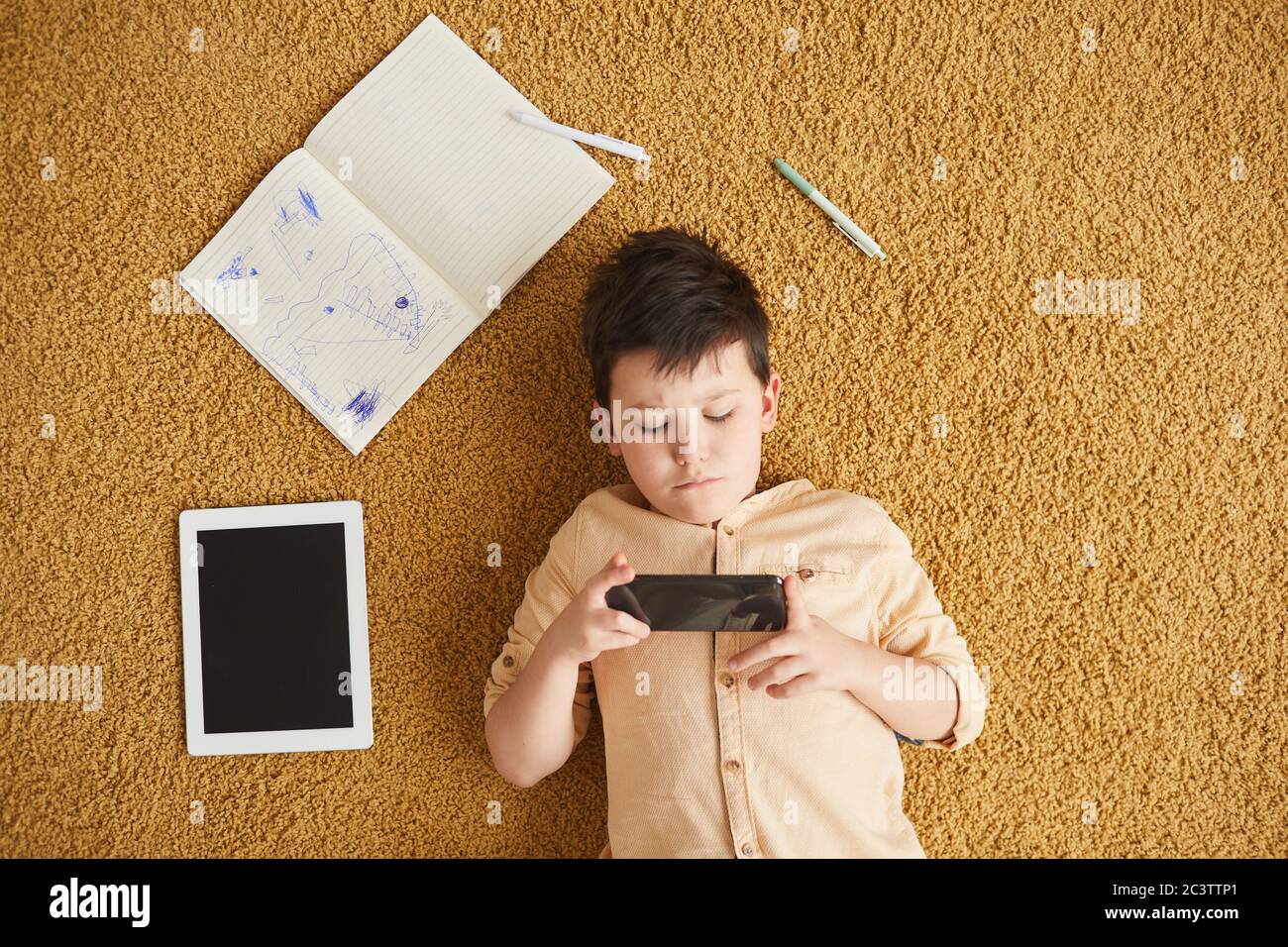 Boy Sitting Down On The Floor High Resolution Stock Photography and ...