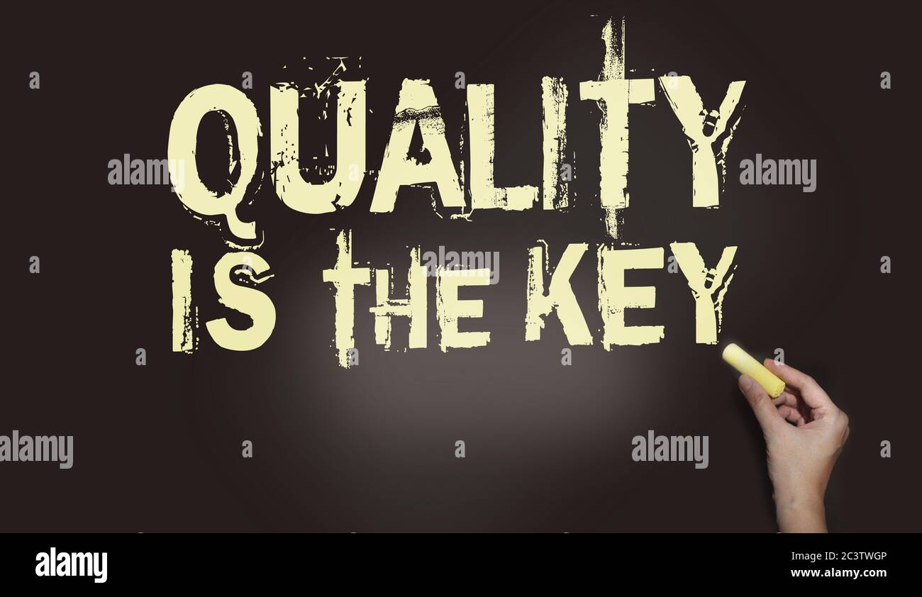 Quality Is The Key text on blackboard written with chalk. Business ...