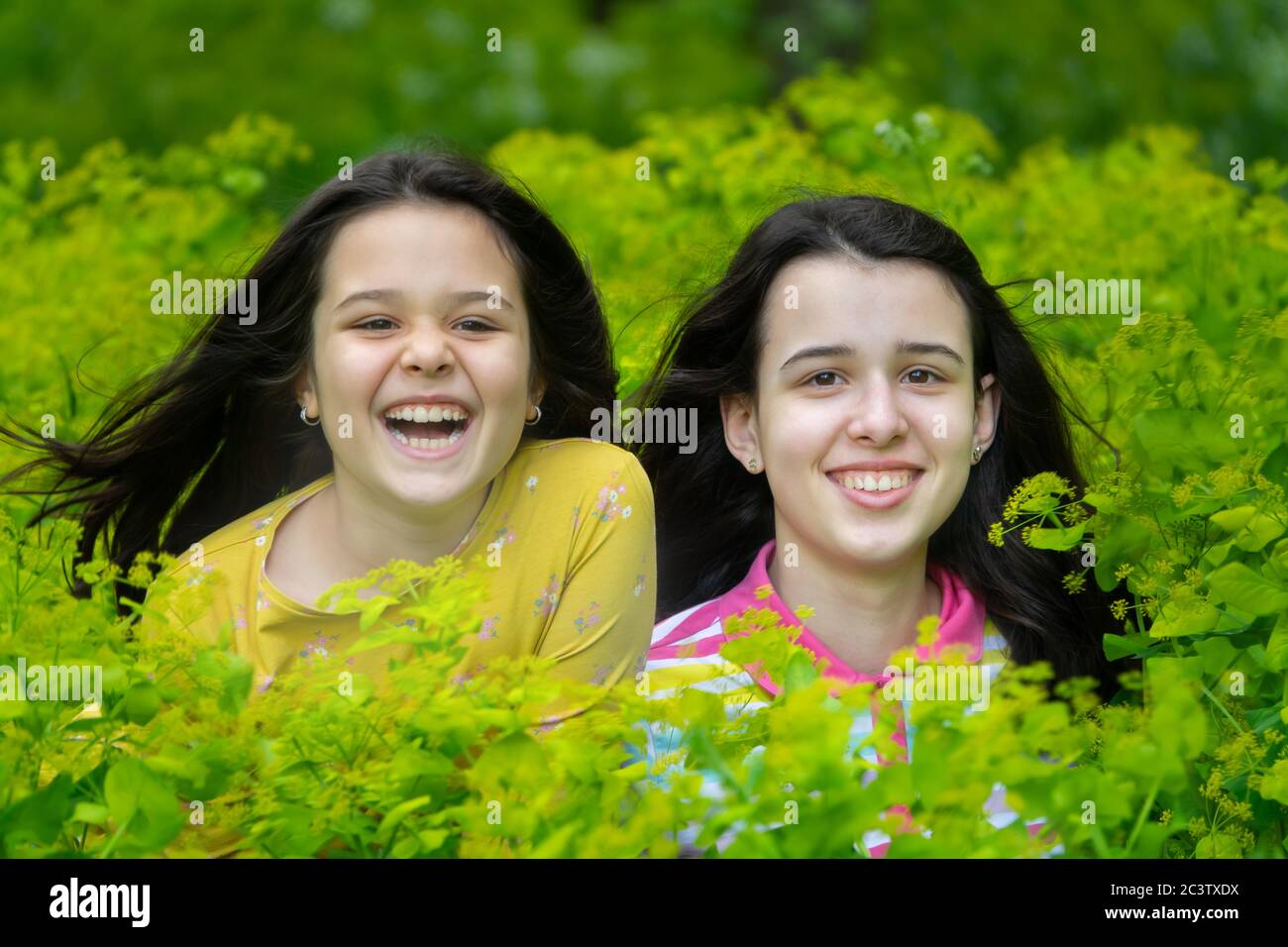 Portrait of two smiling sisters Stock Photo - Alamy