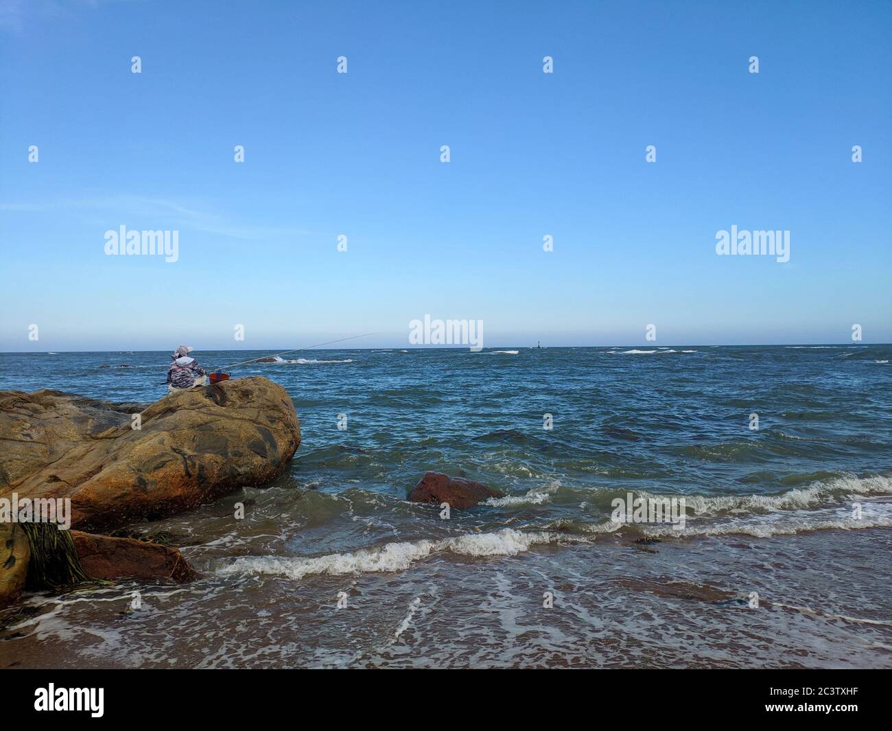 Man rock fishing hi-res stock photography and images - Alamy