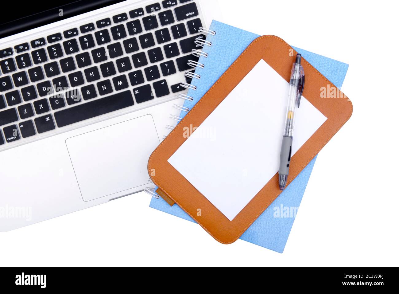 Laptop and note book with pen isolated over white background Stock ...