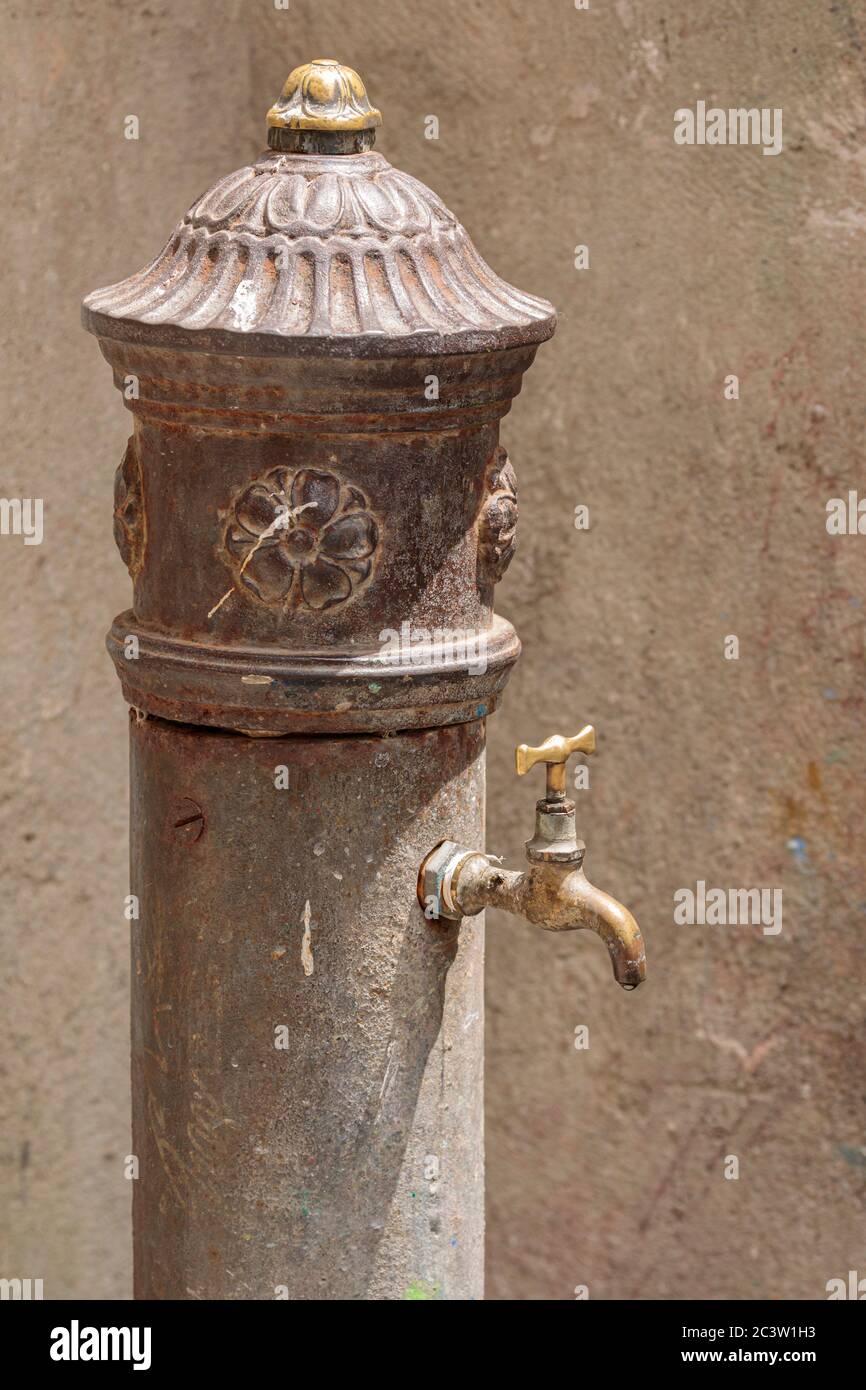 Water tap in street in the medieval hill town of Pitigliano, Tuscany ...