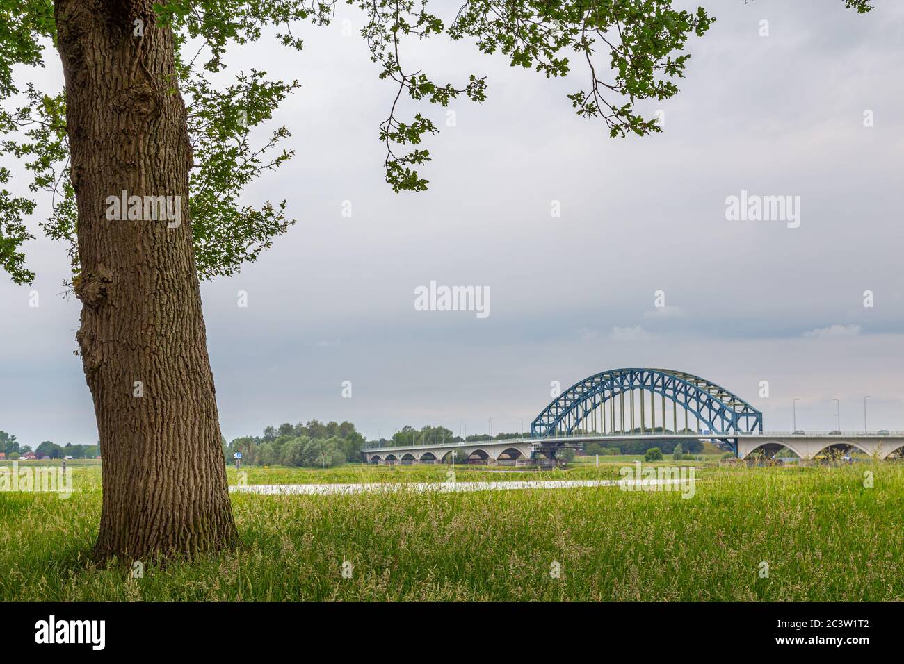 Large blue IJssel bridge crossing the river IJssel in Zwolle ...