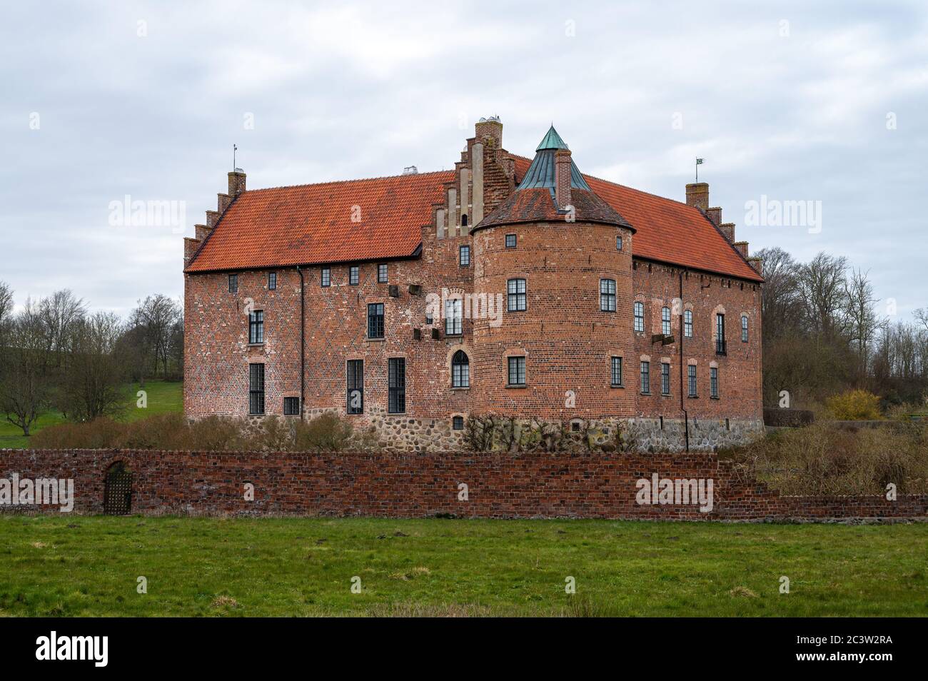 Torup, Sweden - April 1, 2020: The medieval brick castle is surrounded ...