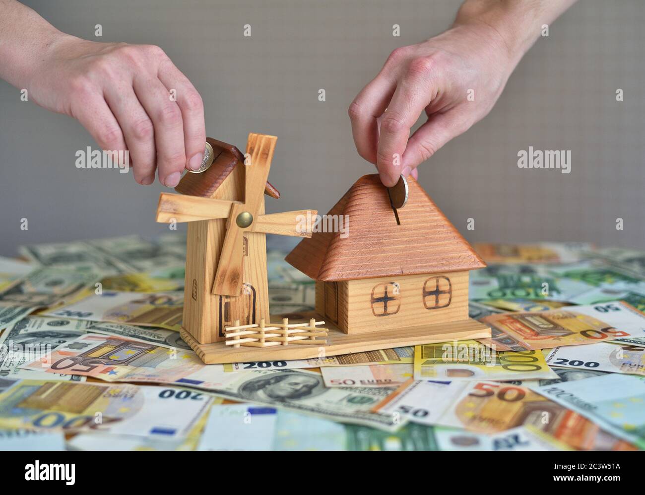 Hand putting gold coin hi-res stock photography and images - Alamy